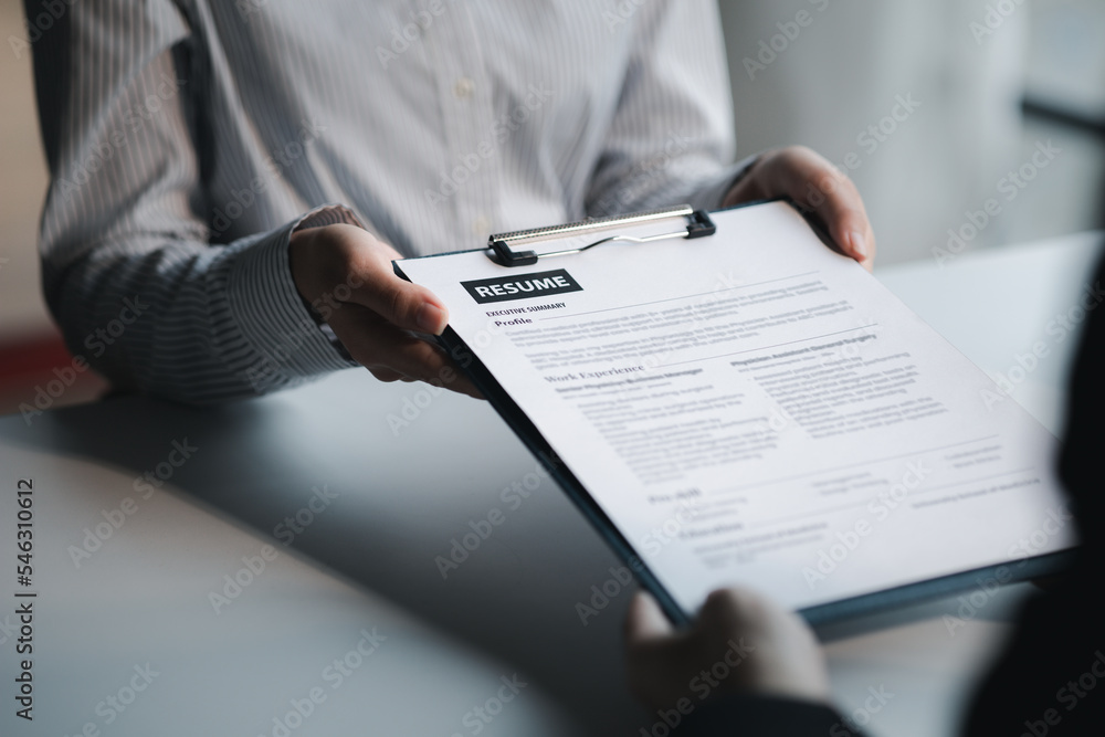 The HR department is reviewing the resumes of job applicants, resumes ...