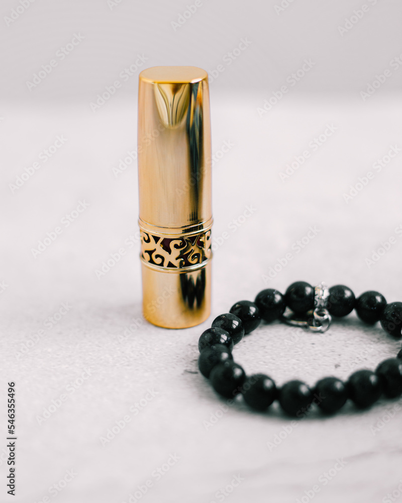Beautiful bright lipstick in a gold box. lipstick in golden tube on ...