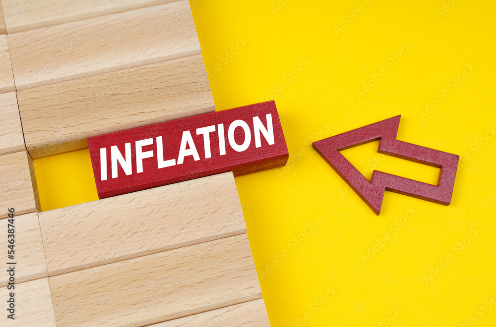 On a yellow surface are wooden blocks and an arrow pointing to a block ...