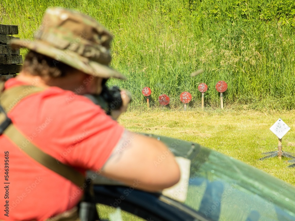 soldier with a rifle firing at targets down range Stock Photo | Adobe Stock