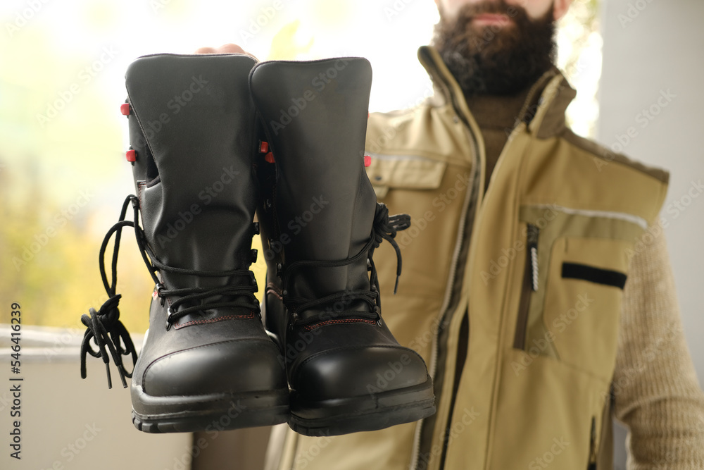 black work boots made of leather with reinforced cape, high top in ...
