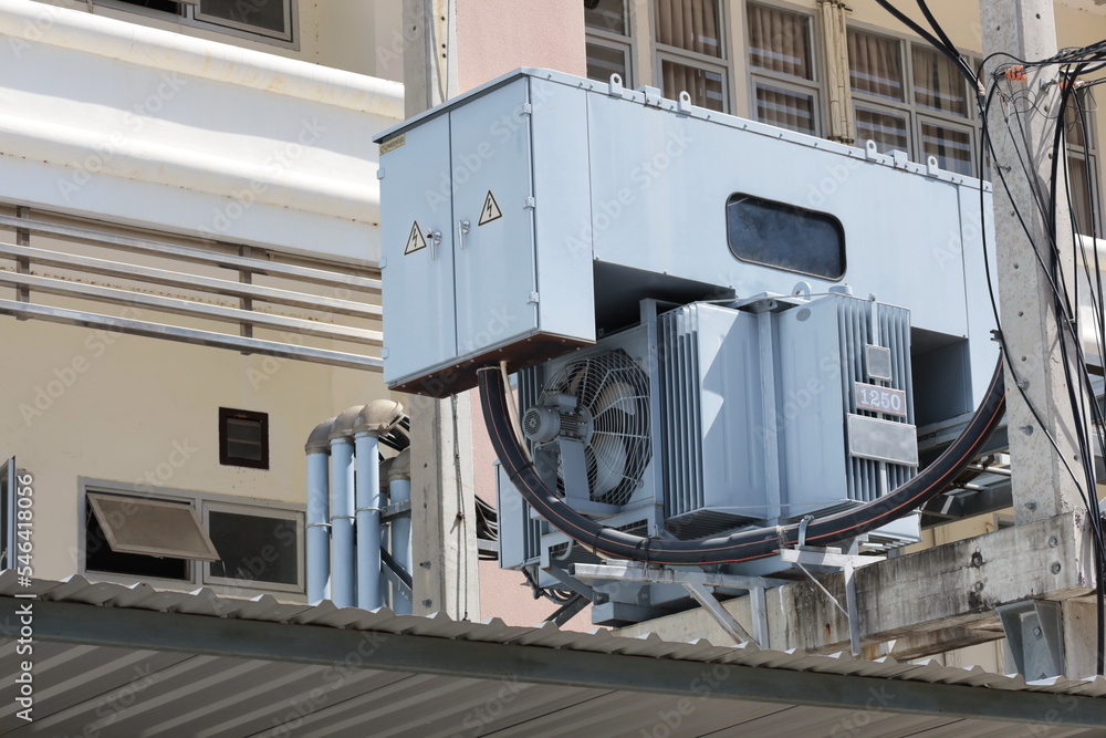 Large transformer on pole. Closeup of large high voltage transformer ...