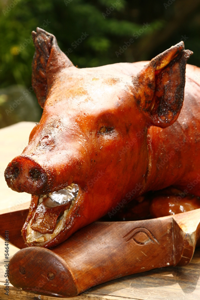 Lechon - slowly roasted stuffed sucking pig, a holiday dish popular in ...