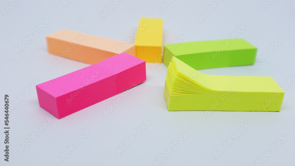 Post it or a colorful sticky note to mark pages in a book, magazine or ...