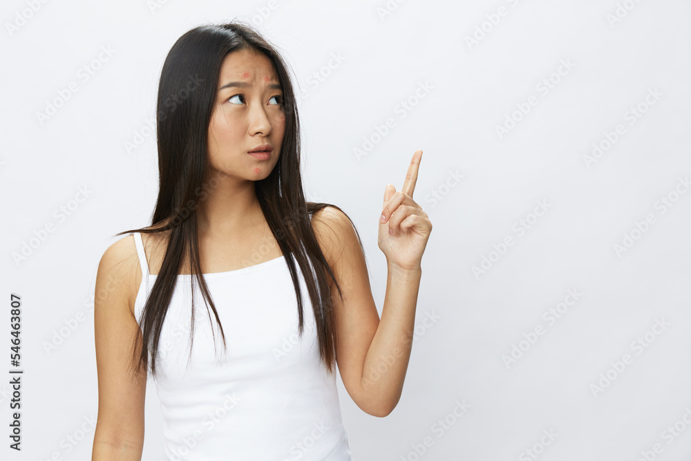Asian woman hand signals, finger pointing facial skin problems, acne ...