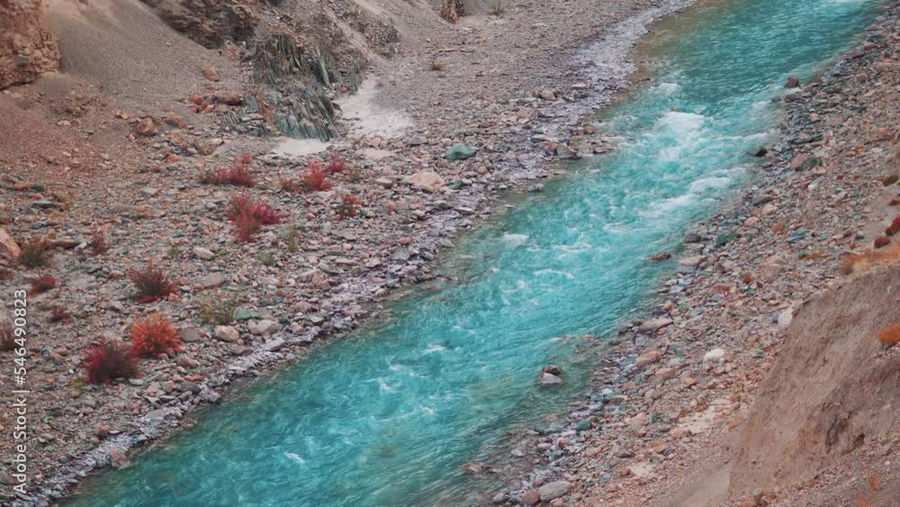 4K High angle shot of the blue Tsarap River flowing as seen from the ...