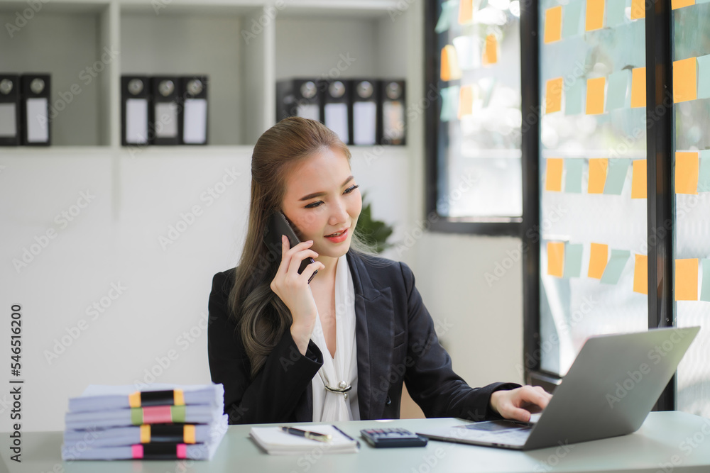 business woman or accountant who are using a calculator to calculate ...