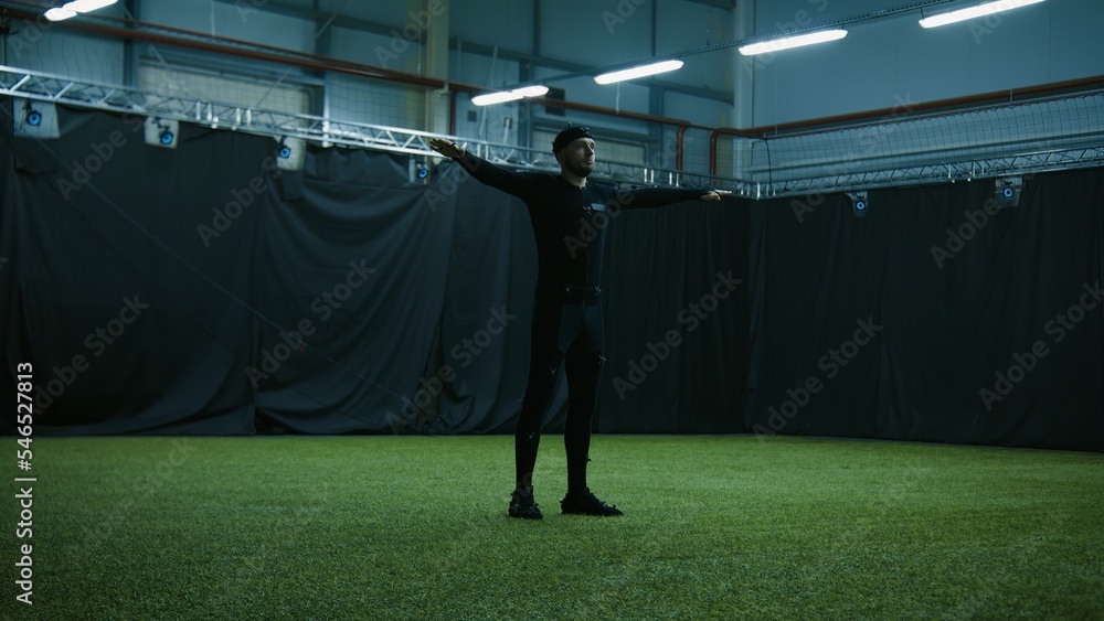 BTS of filmmaking. Actor is standing in T-pose for calibrating motion ...
