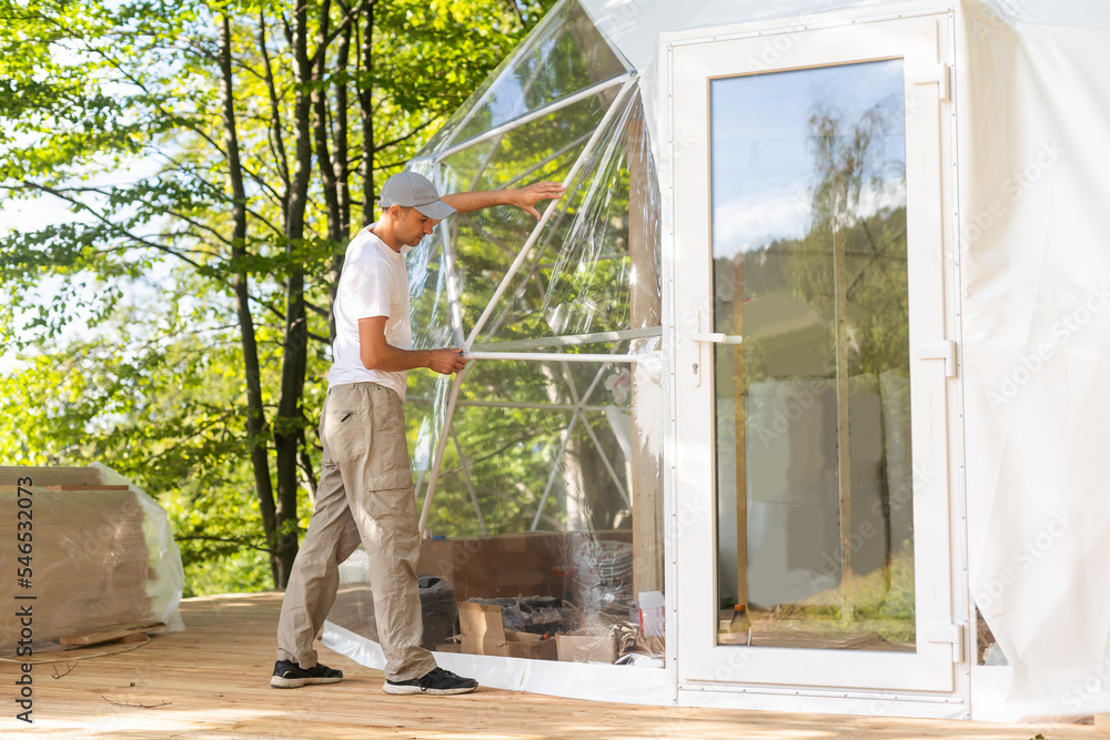 the master builds the dome. Outside spherical glamping dome ...