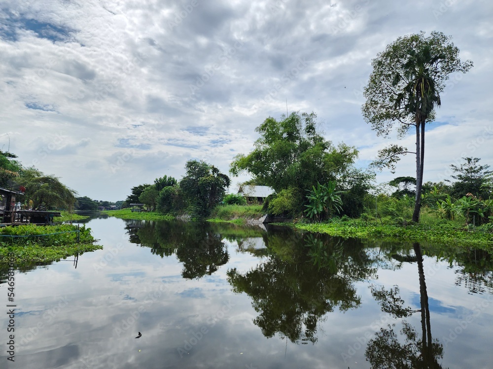 Rivers that people use as a thoroughfare by boat. There are trees and ...