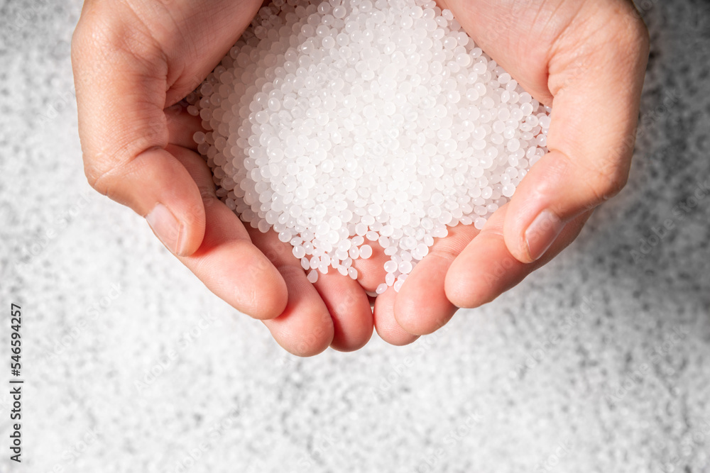 engineer hold white plastic on hand polymer petrochemical product as ...