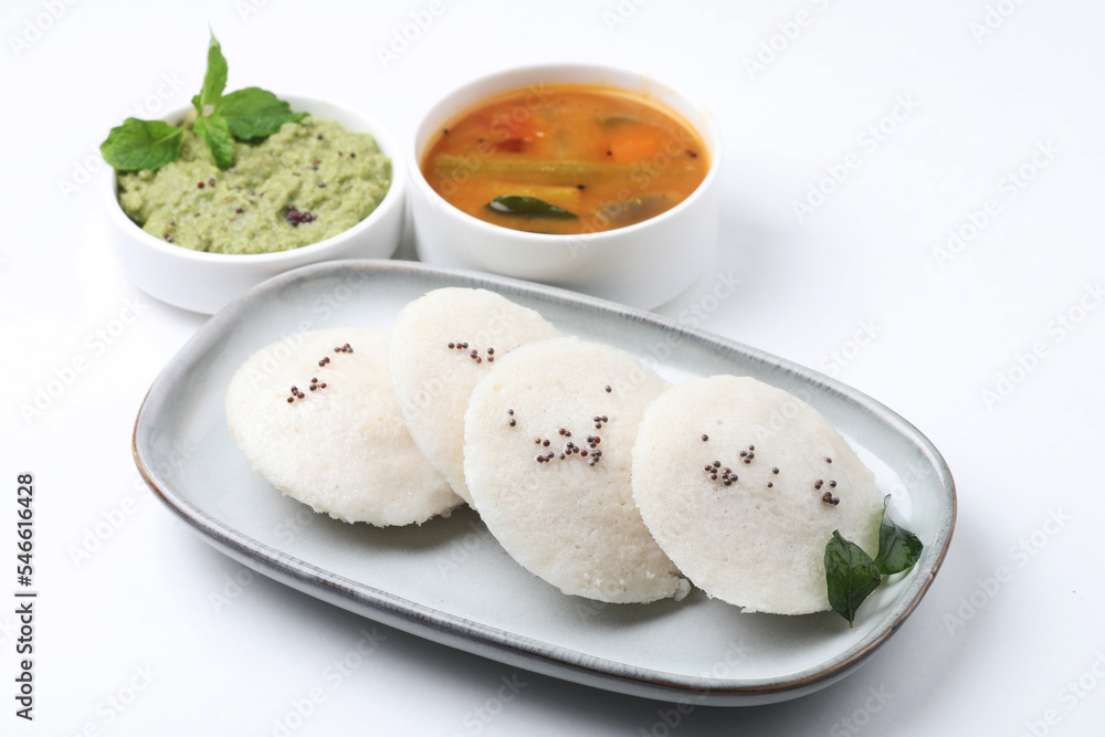 Idly sambar or Idli with Sambhar and green, red chutney. Popular South ...