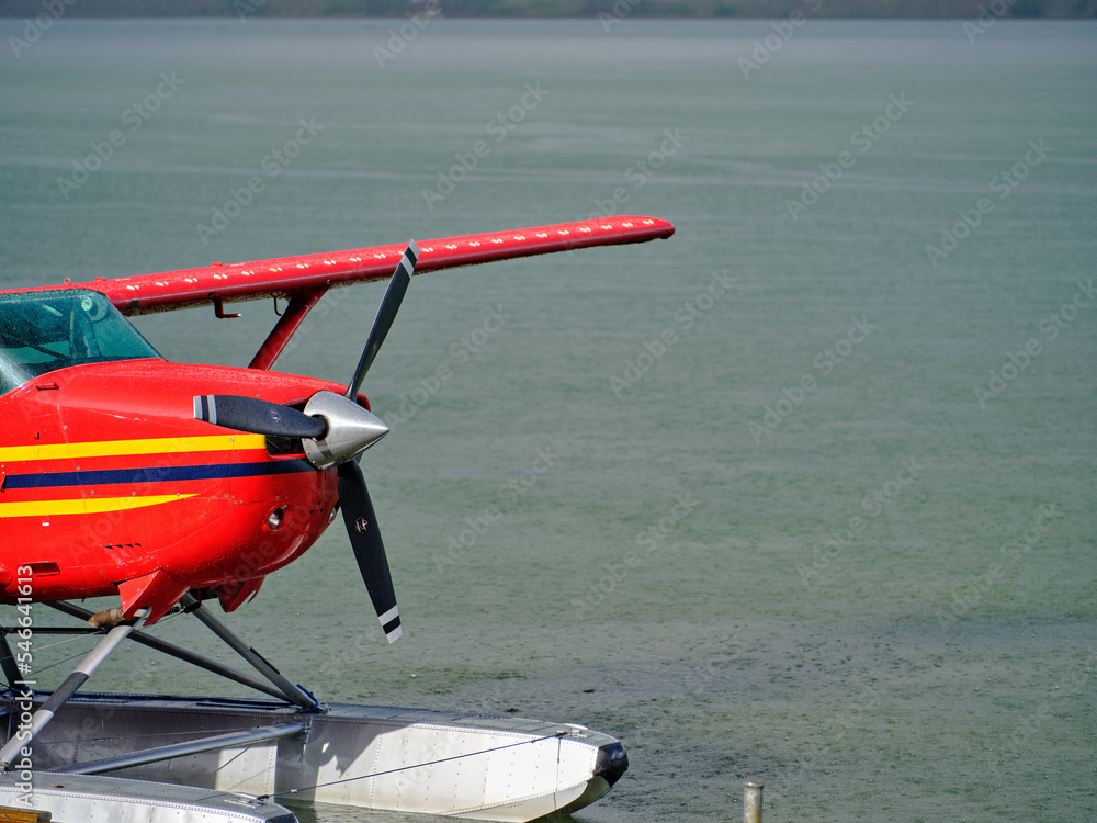 Red seaplane float plane after a thunderstorm in the town of Whitehorse ...