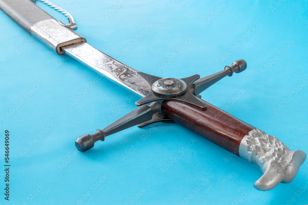 Cossack sword in a scabbard, close-up on a blue background Stock Photo ...