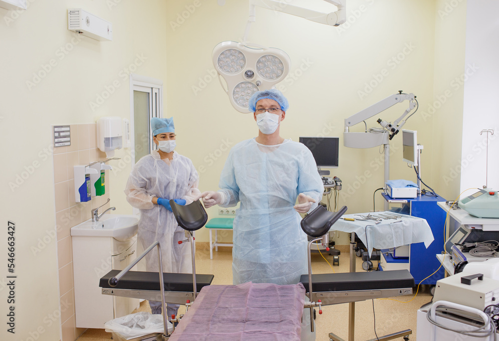 The proctologist invites the patient to take a seat in the proctology ...