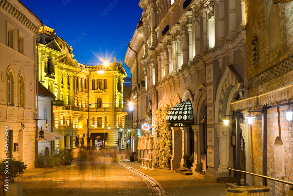 Night view of illuminated Ausros Vartu Street in the Old Town of ...