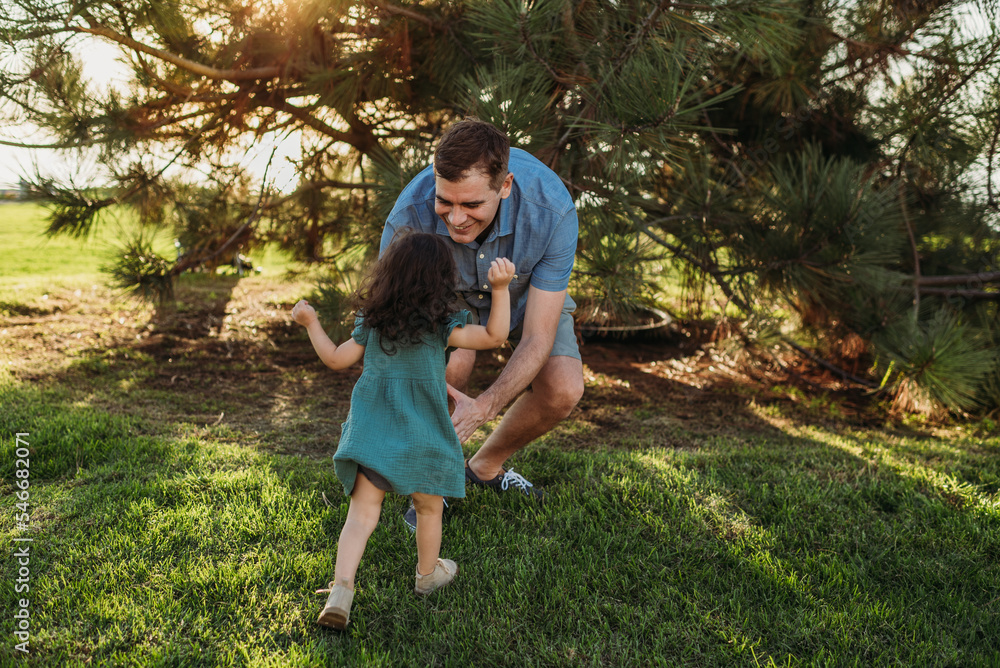 Daughter running to dad Stock Photo | Adobe Stock