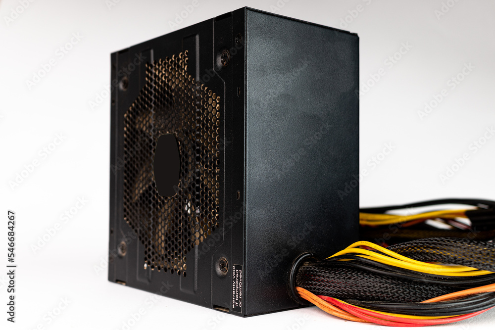 Computer power supply unit standing with wires and cables - black ...