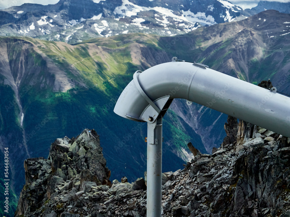 Snowmaking snow gun or cannon on Swiss Alps mountain valley, summer ...