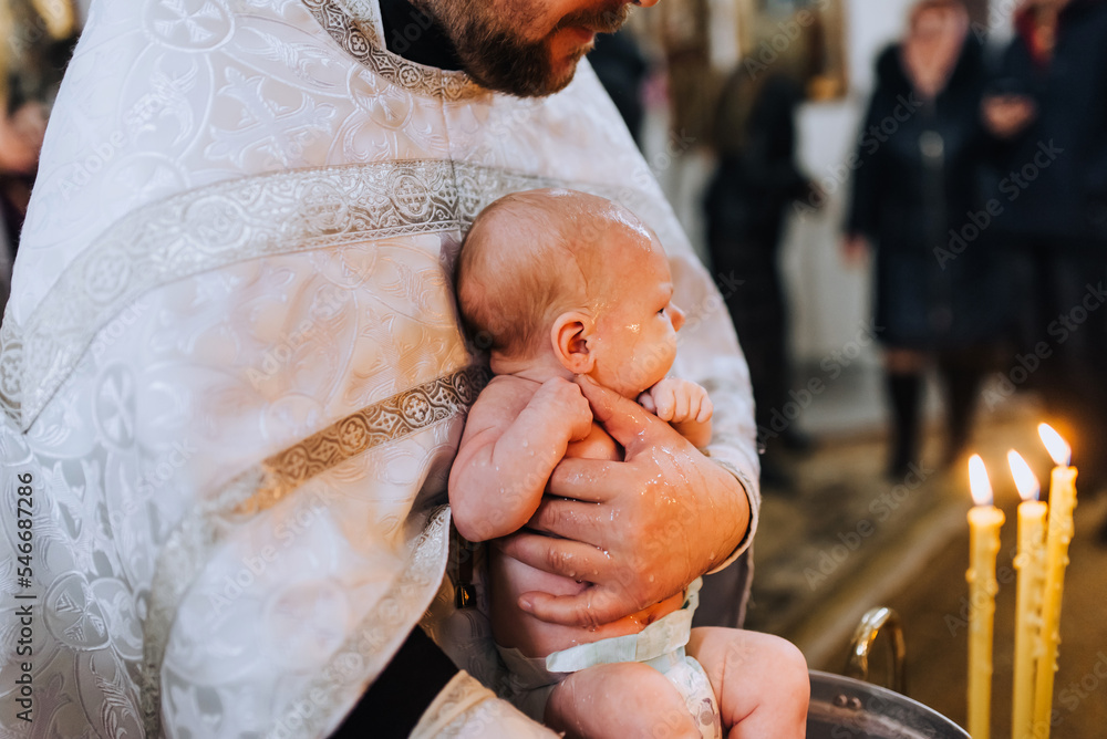 A male Christian priest in a church conducts a sacred rite, a ritual ...