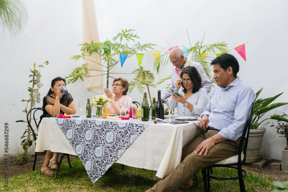 Family all together at a birthday party table Stock Photo | Adobe Stock