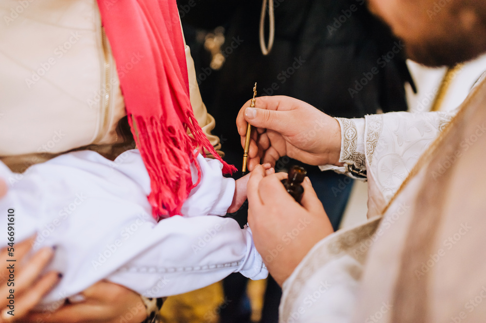 The priest in the church conducts the ceremony, the ritual of anointing ...