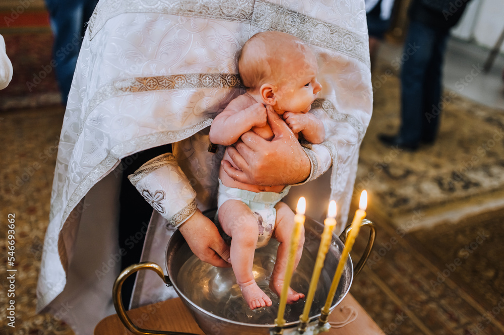 A male Christian priest in a church conducts a sacred rite, a ritual ...