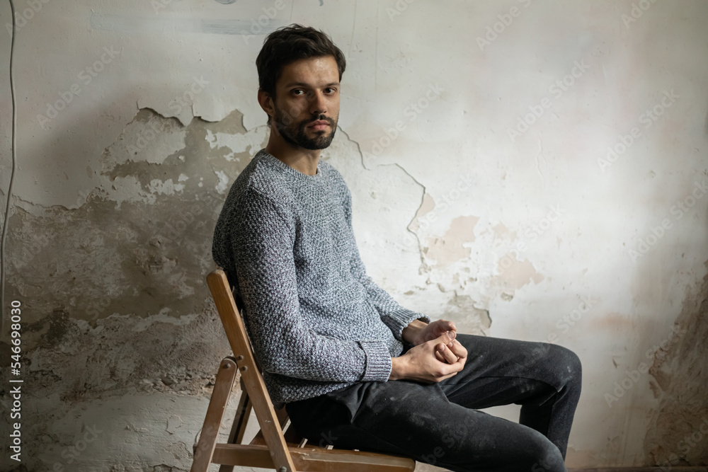 handsome man sitting on a chair Stock Photo | Adobe Stock
