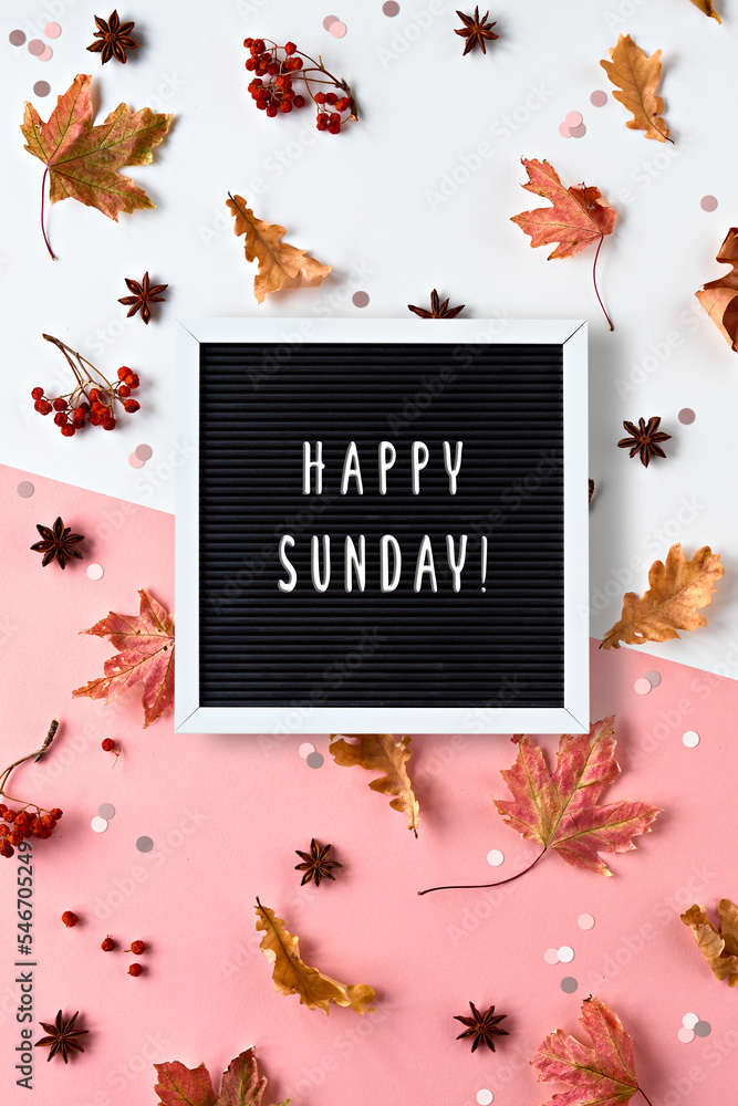 Happy Sunday greeting text on text board. Autumn leaves, spices and ...
