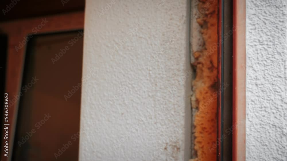 Dismantling of old window. Builder replacing wood window frame ...