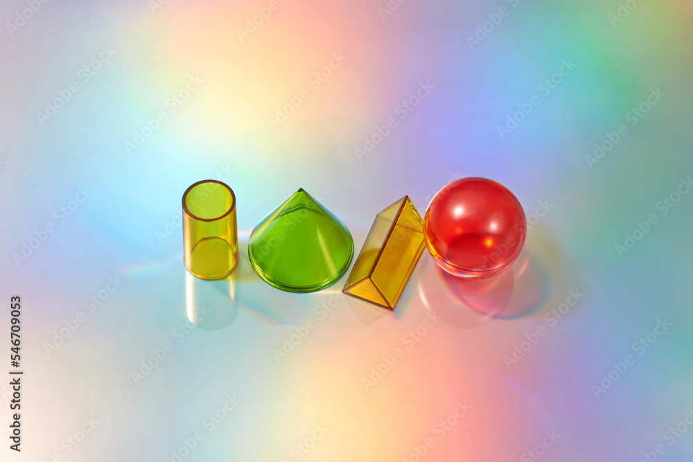 Different colorful glass geometric shapes. Stock Photo | Adobe Stock