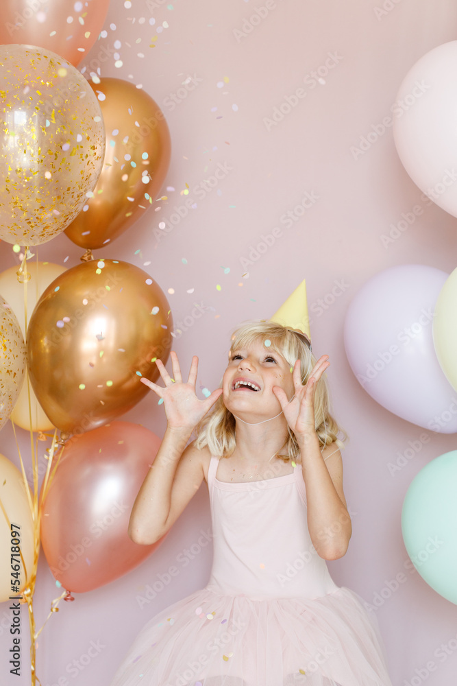 A birthday girl with balloons. Stock Photo | Adobe Stock