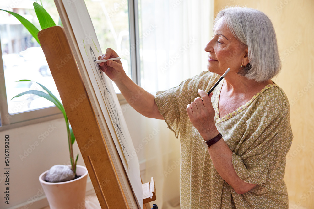 Female pensioner drawing portrait in daytime Stock Photo | Adobe Stock