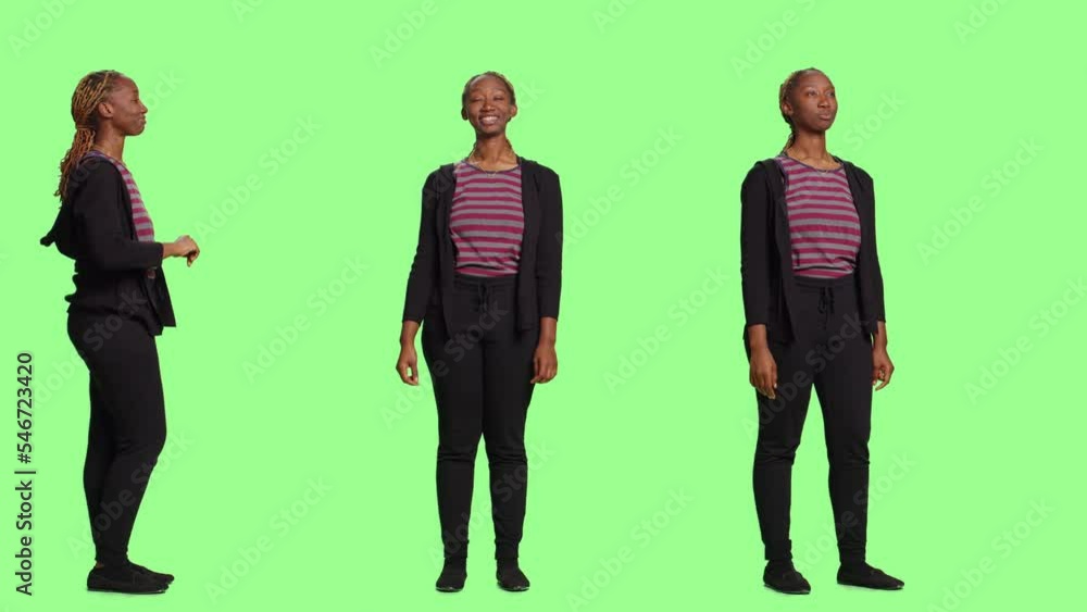 Modern woman looking at 3d hologram over greenscreen backdrop, using ...