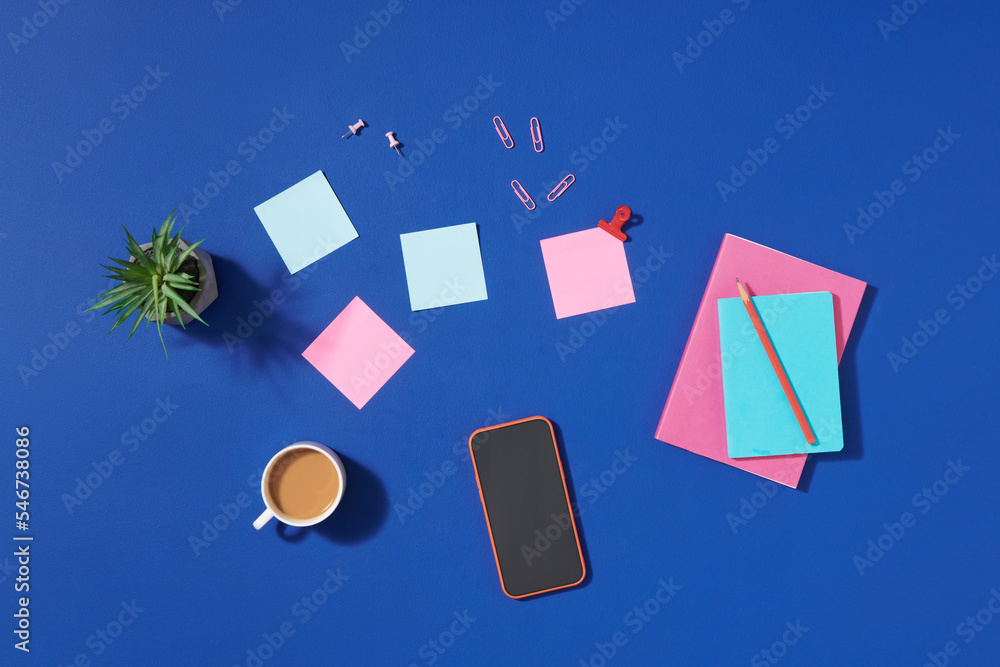Top view of student table with headphone and stationery on blue Stock ...