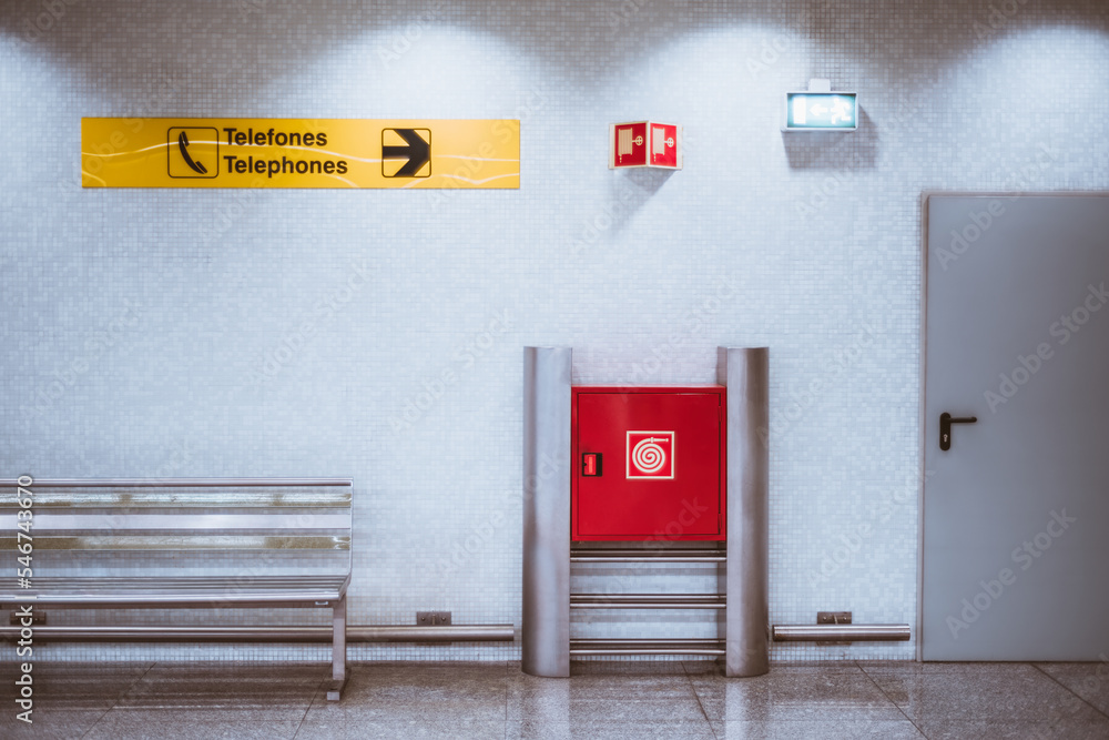 An interior of an airport terminal or a subway train station with a red ...