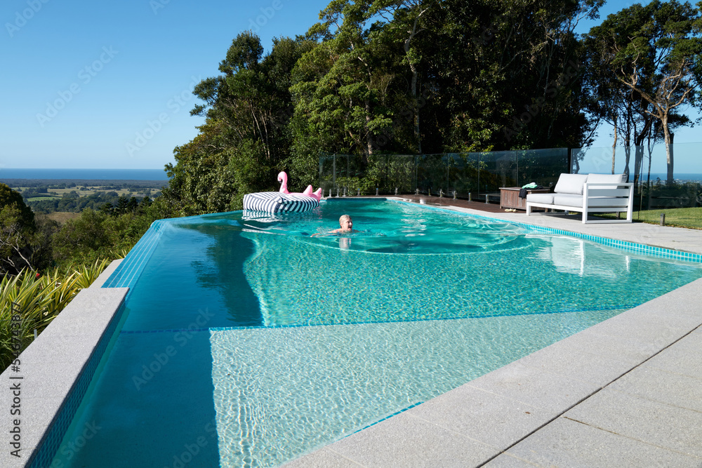 Large infinity pool at luxury home Stock Photo | Adobe Stock