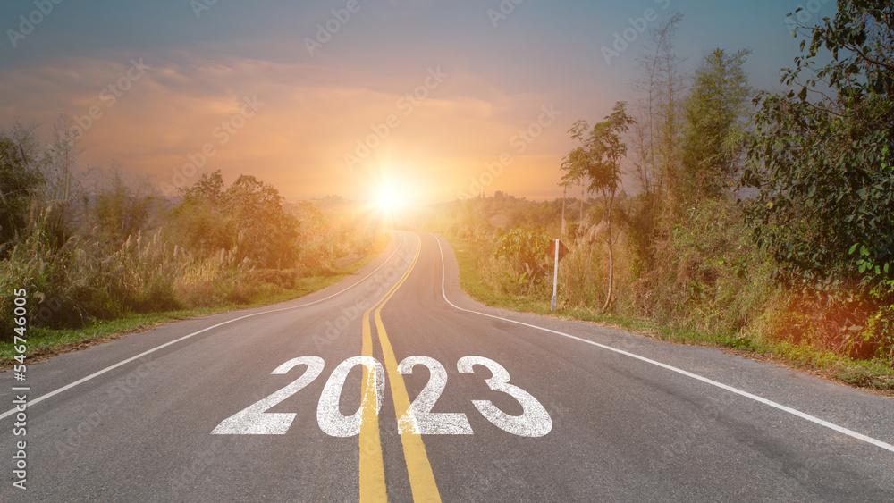 New year 2023 forward concept. Word 2023 written on the asphalt road at ...