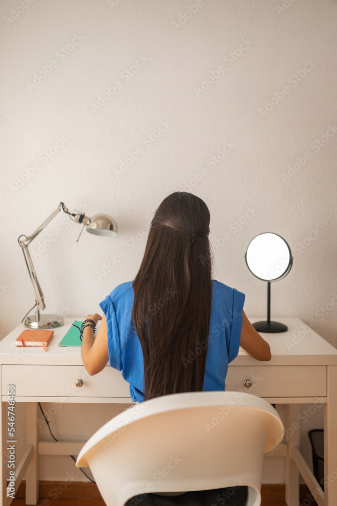 teenage girl studying at her bedroom desk Stock Photo | Adobe Stock