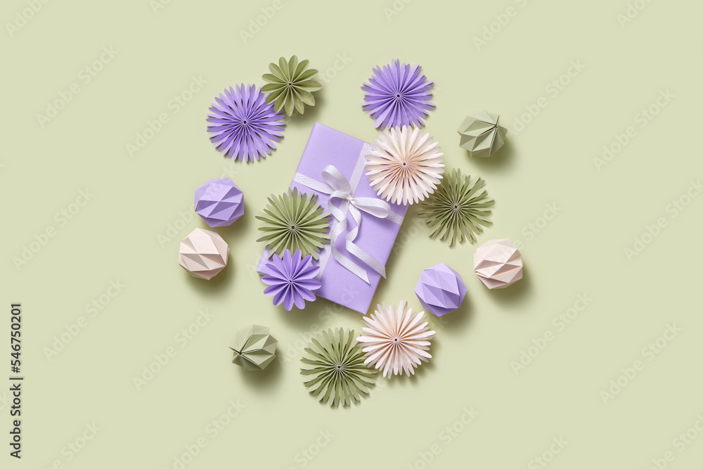 Papercraft ornaments around Christmas present. Stock Photo | Adobe Stock