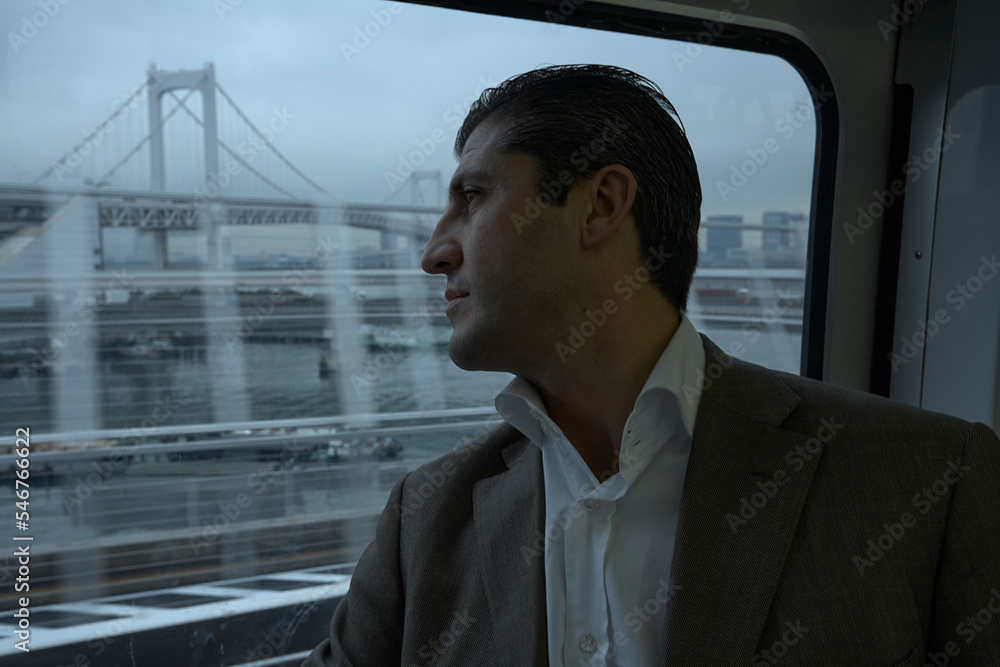 man looking out the window Stock Photo | Adobe Stock