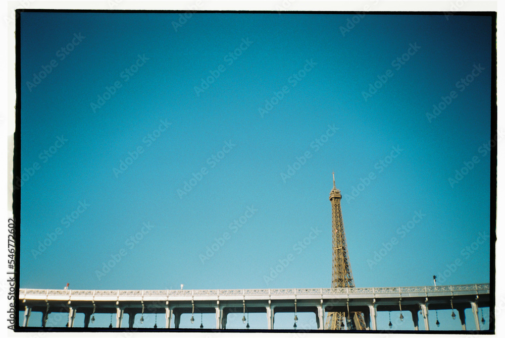 Abstract Paris architecture with tip of Eiffel Tower Bridge Bir-Hakeim ...
