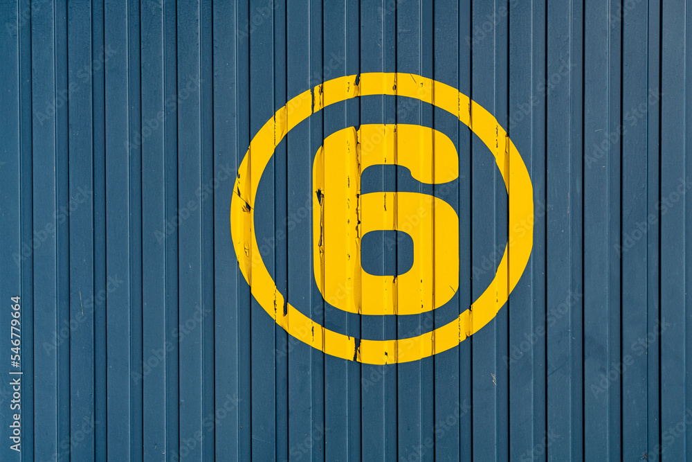 Circled Number Six On Wall Stock Photo | Adobe Stock