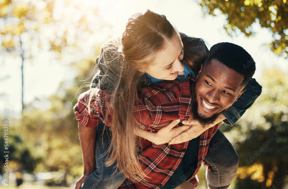 Love, piggy back and couple in park walking, smile and happy together ...