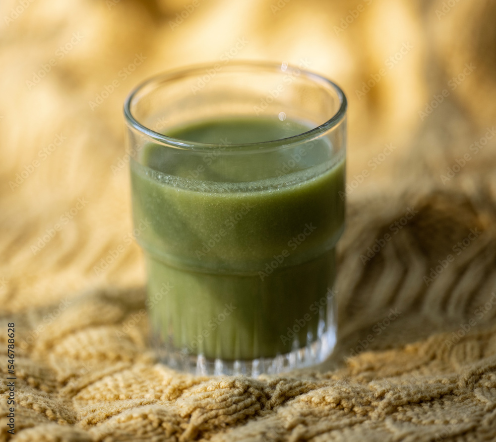 Little glass of green juice Stock Photo | Adobe Stock