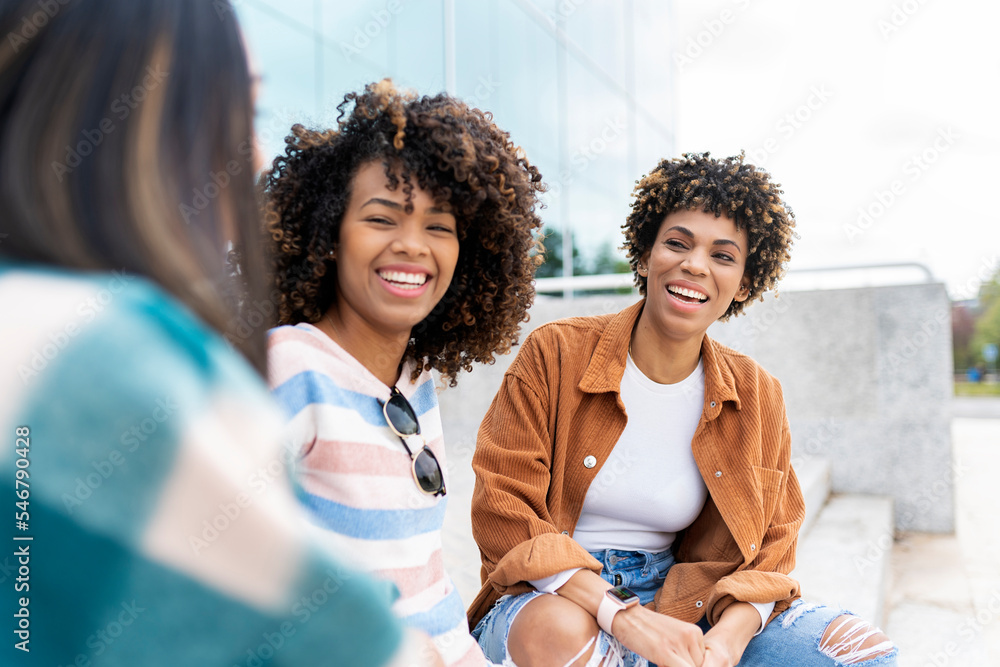 Happy cool Friends Talking Stock Photo | Adobe Stock