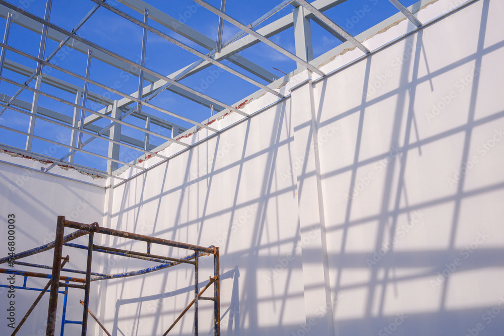 Aluminum c-line ceiling structure and scaffolding with white concrete ...
