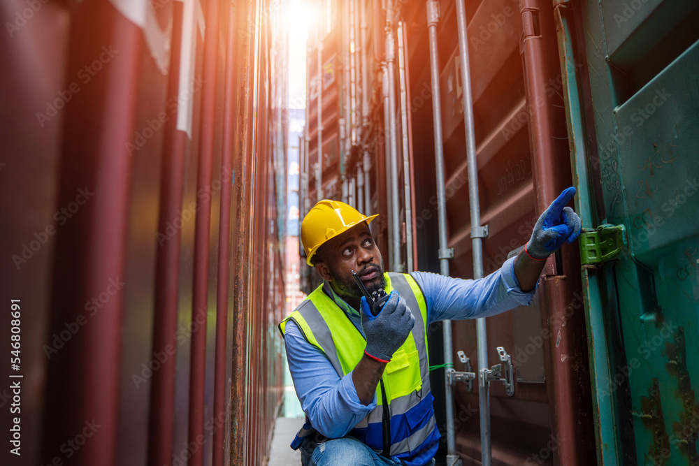 Worker check list of container cargo at container depot terminal ...