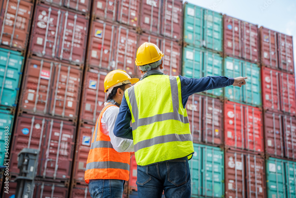 Engineer working and checking a quality of containers box from cargo ...