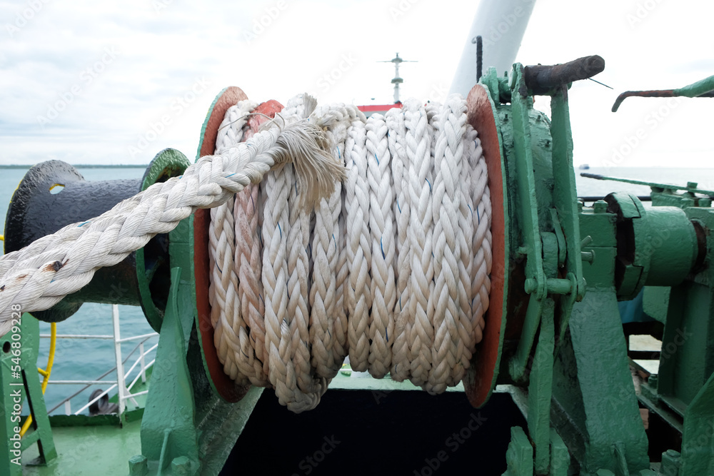 Mooring crane ropes on marine boat drums. Deck mooring mechanism at the ...